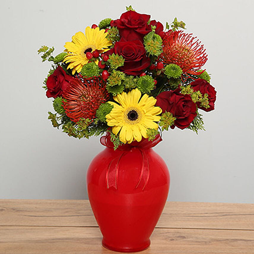 Mixed Flowers Arrangement In Red Glass Vase Delivery in Singapore - FNP SG