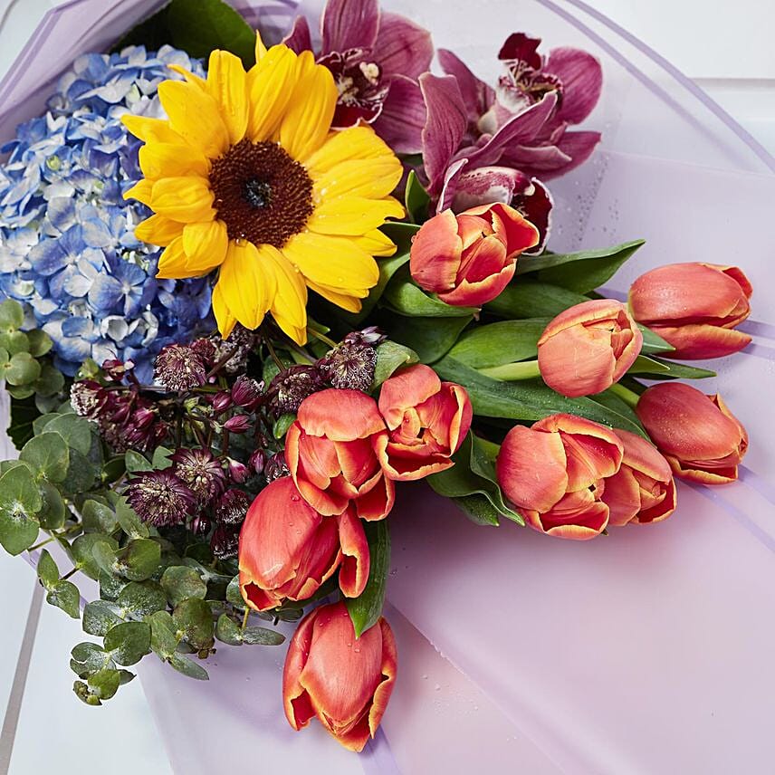 Vibrant Mixed Flowers Wrapped Bouquet Delivery in Singapore - FNP SG