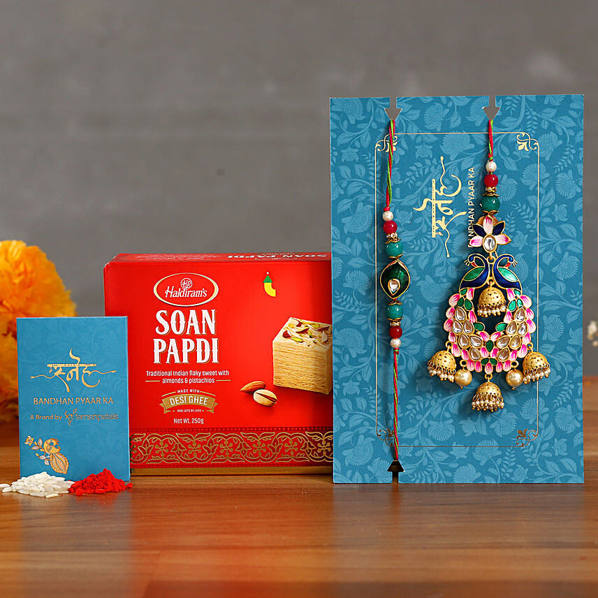 Pink Peacock Lumba Rakhi Set With Soan Papdi Delivery in Singapore - FNP SG