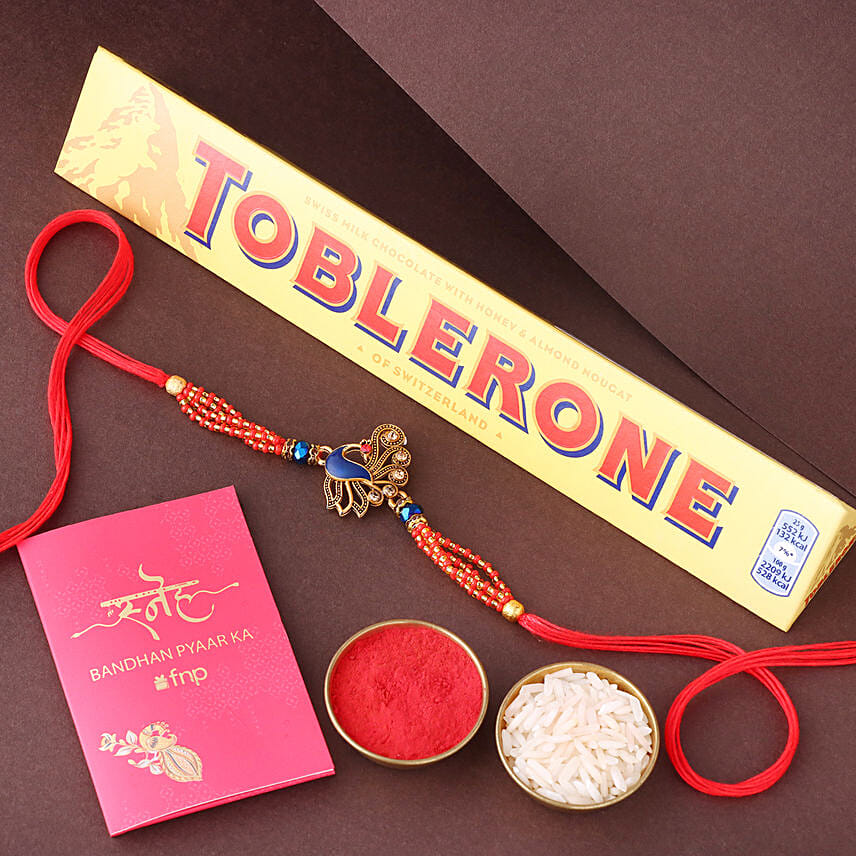 Sneh Blue Peacock Designer Rakhi with Toblerone Chocolate Delivery in ...