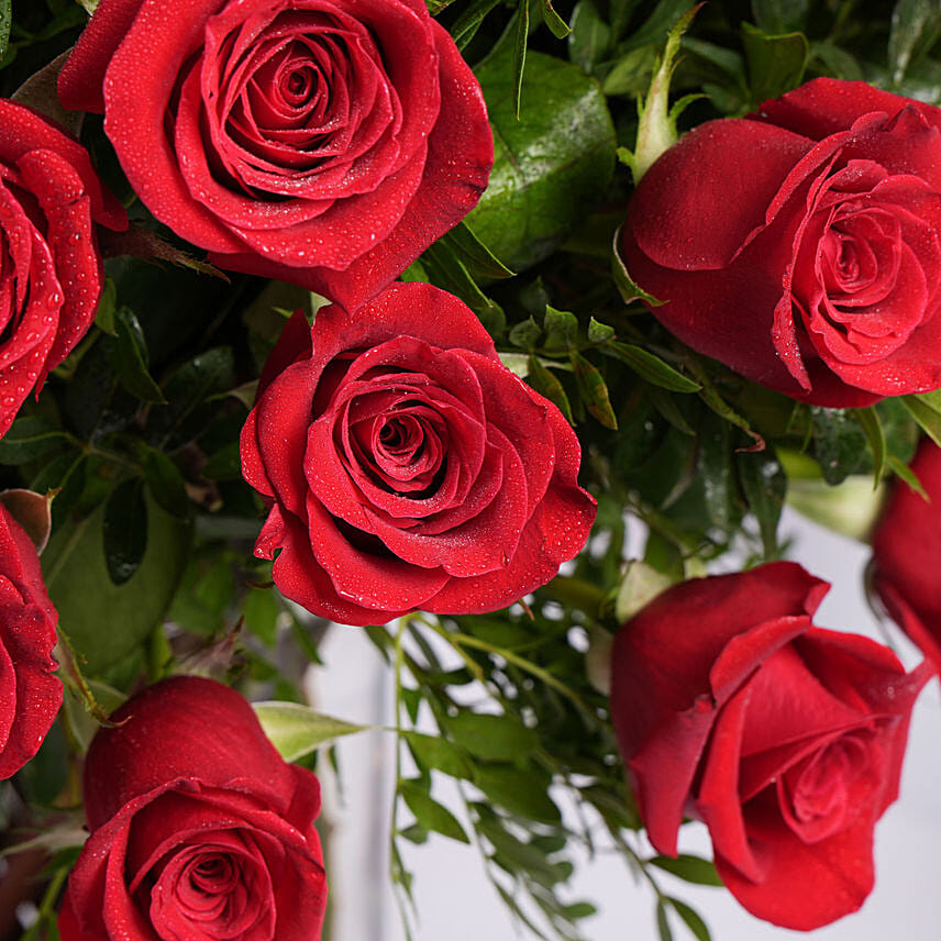 Ravishing 99 Red Roses In Glass Vase Delivery in Singapore - FNP SG