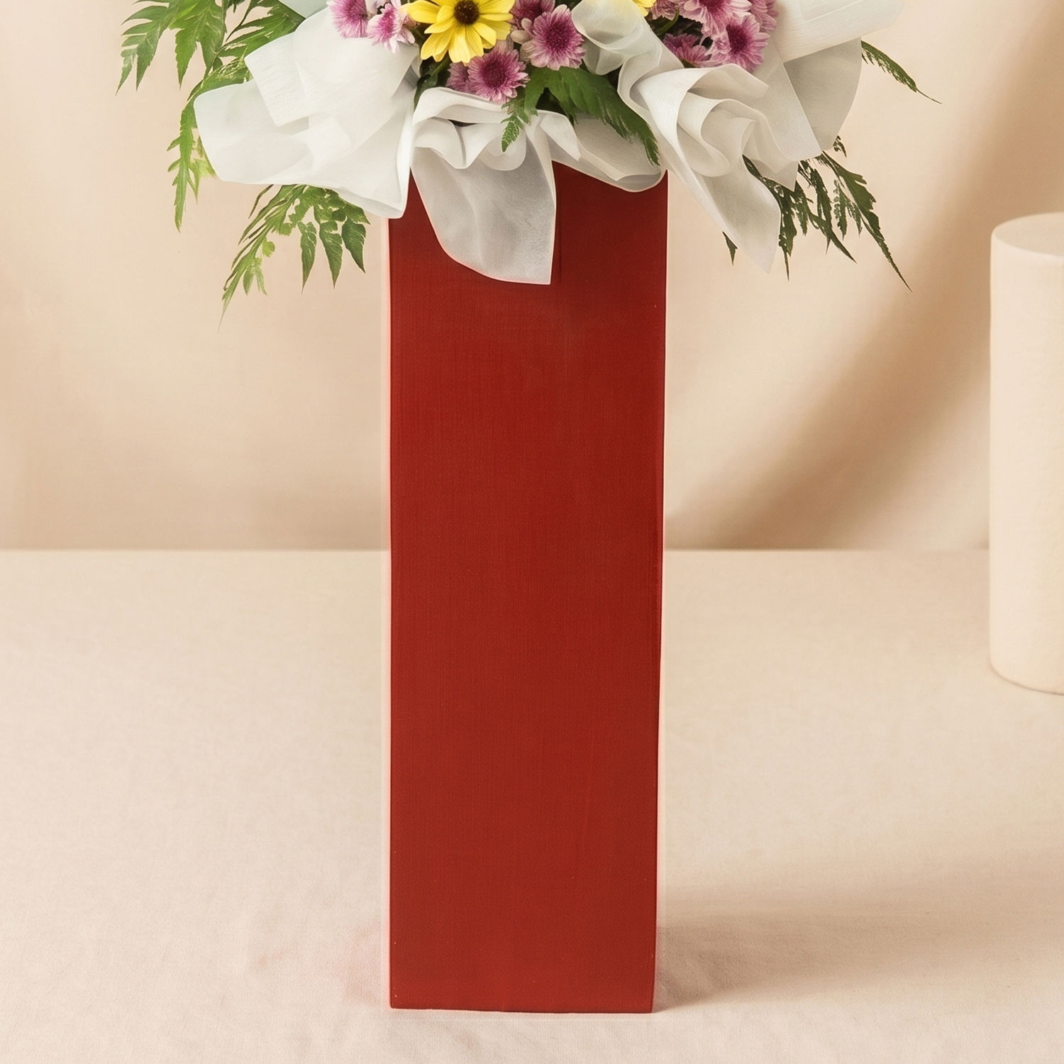 Gerberas Purple Pom In Beautiful Red Stand Delivery in Singapore - FNP SG