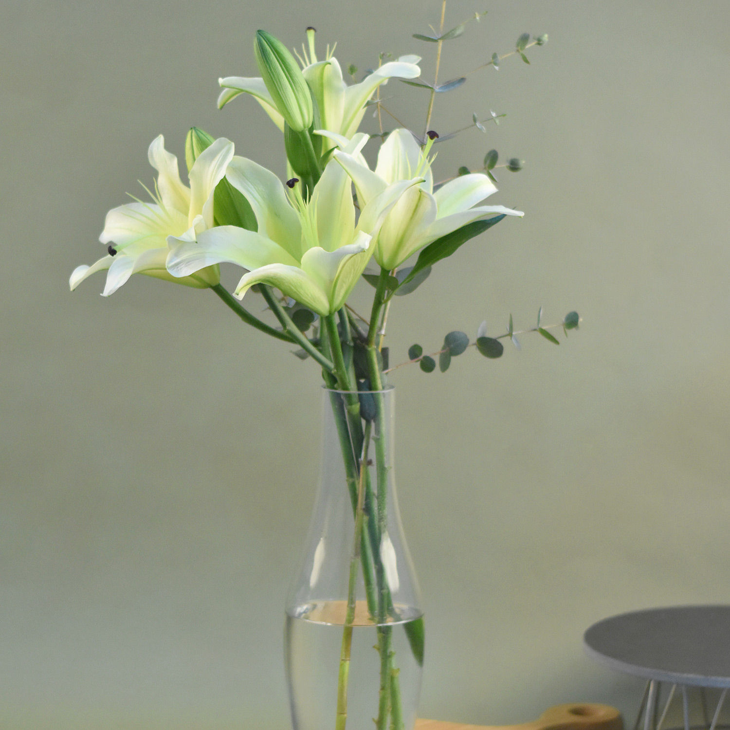 Serene Yellow Lily Bottle Vase Delivery in Singapore - FNP SG