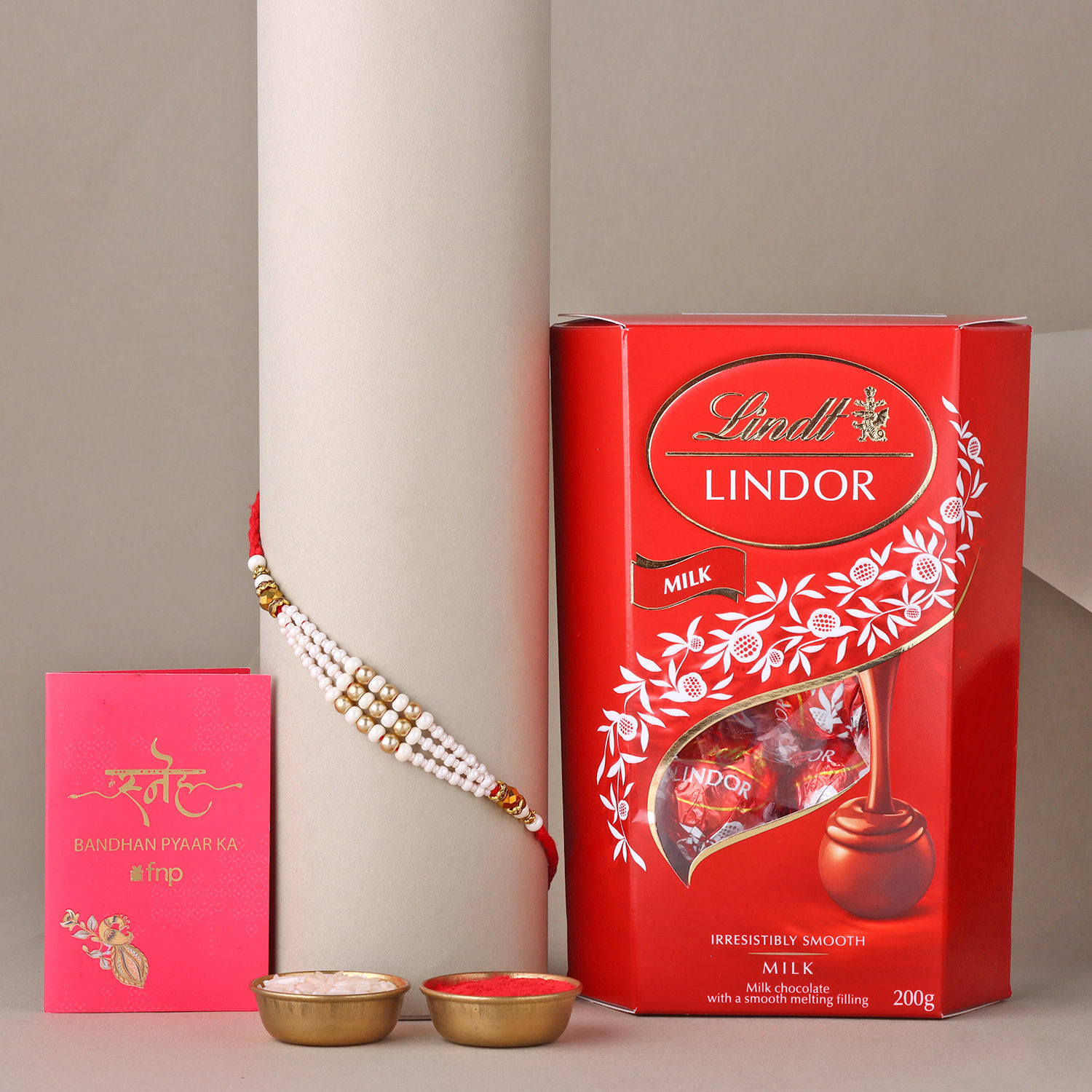 Sneh White Pearl Bead Rakhi and Lindt Lindor Chocolate Box Delivery in ...