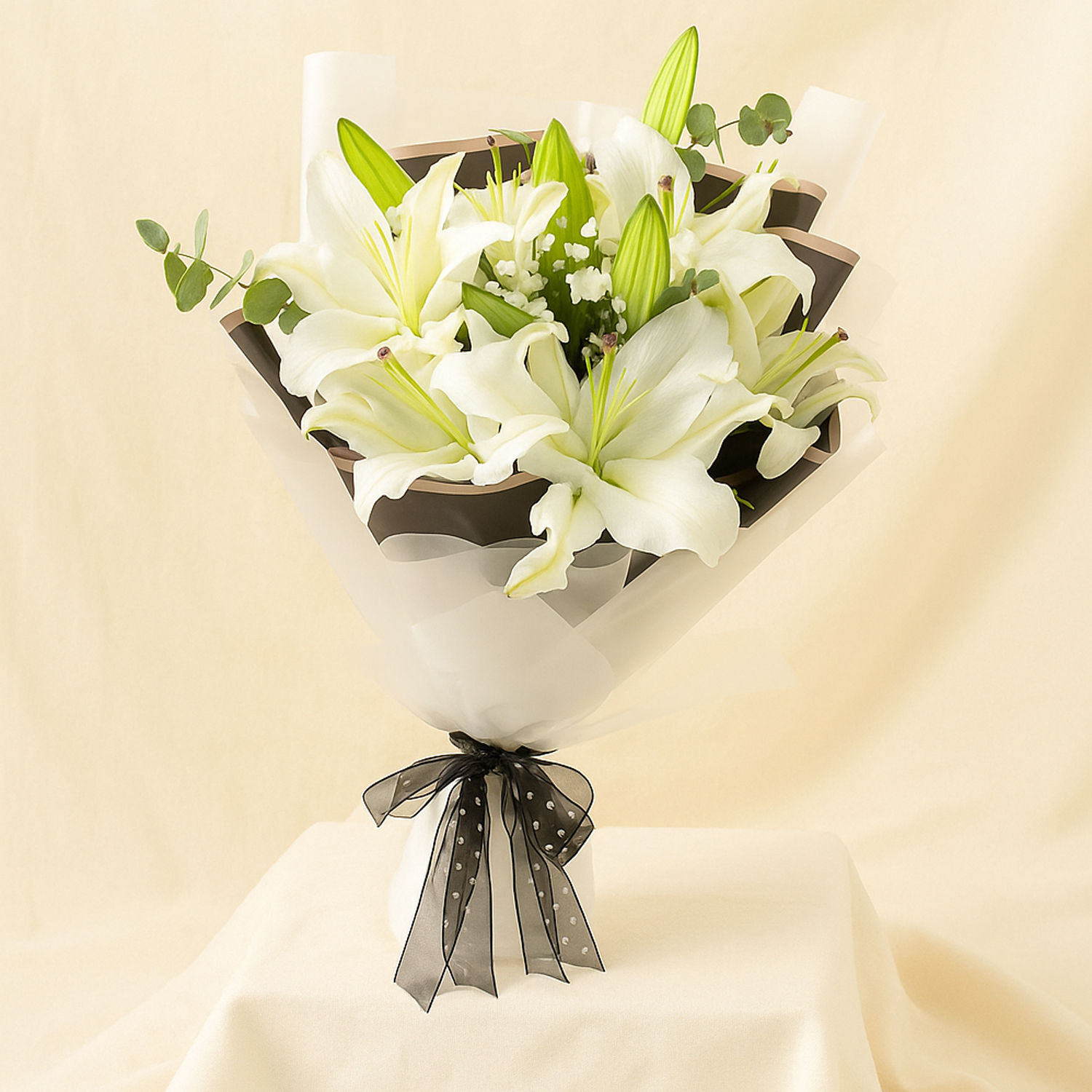 Charming White Lilies Hand Bouquet Delivery in Singapore - FNP SG
