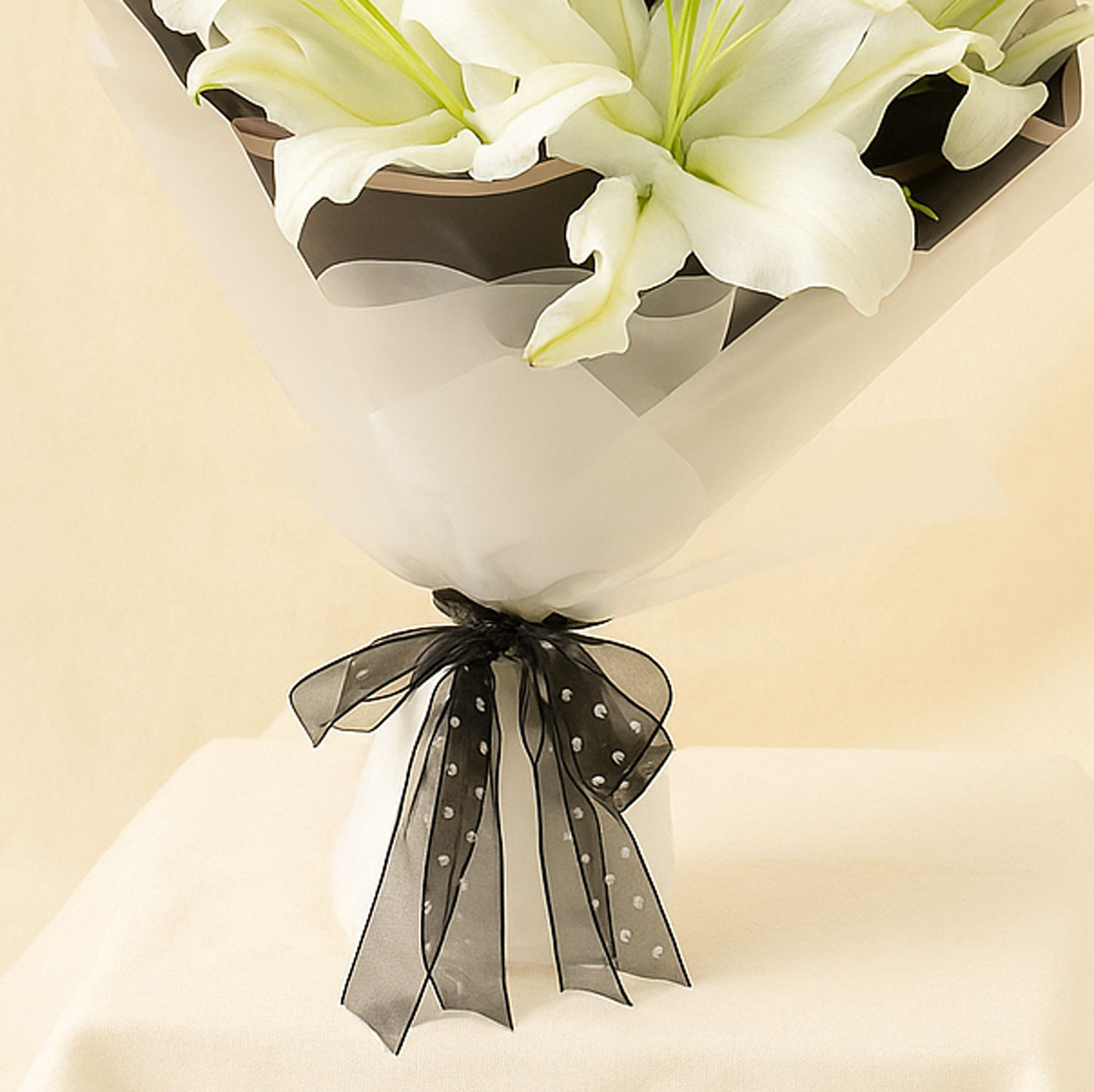 Charming White Lilies Hand Bouquet Delivery in Singapore - FNP SG